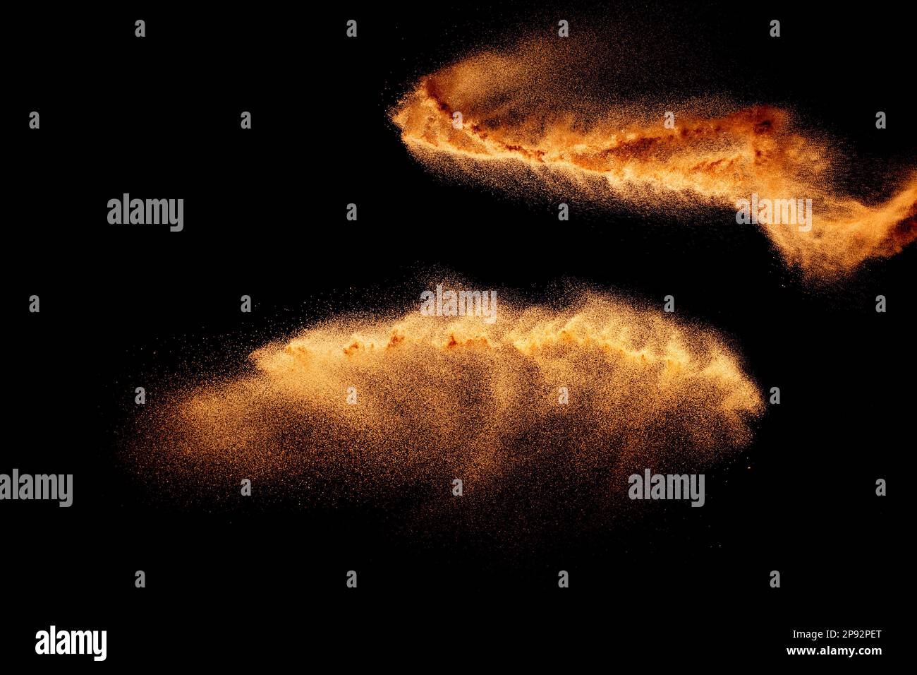 Sand explosion isolated on black background. Freeze motion of sandy ...