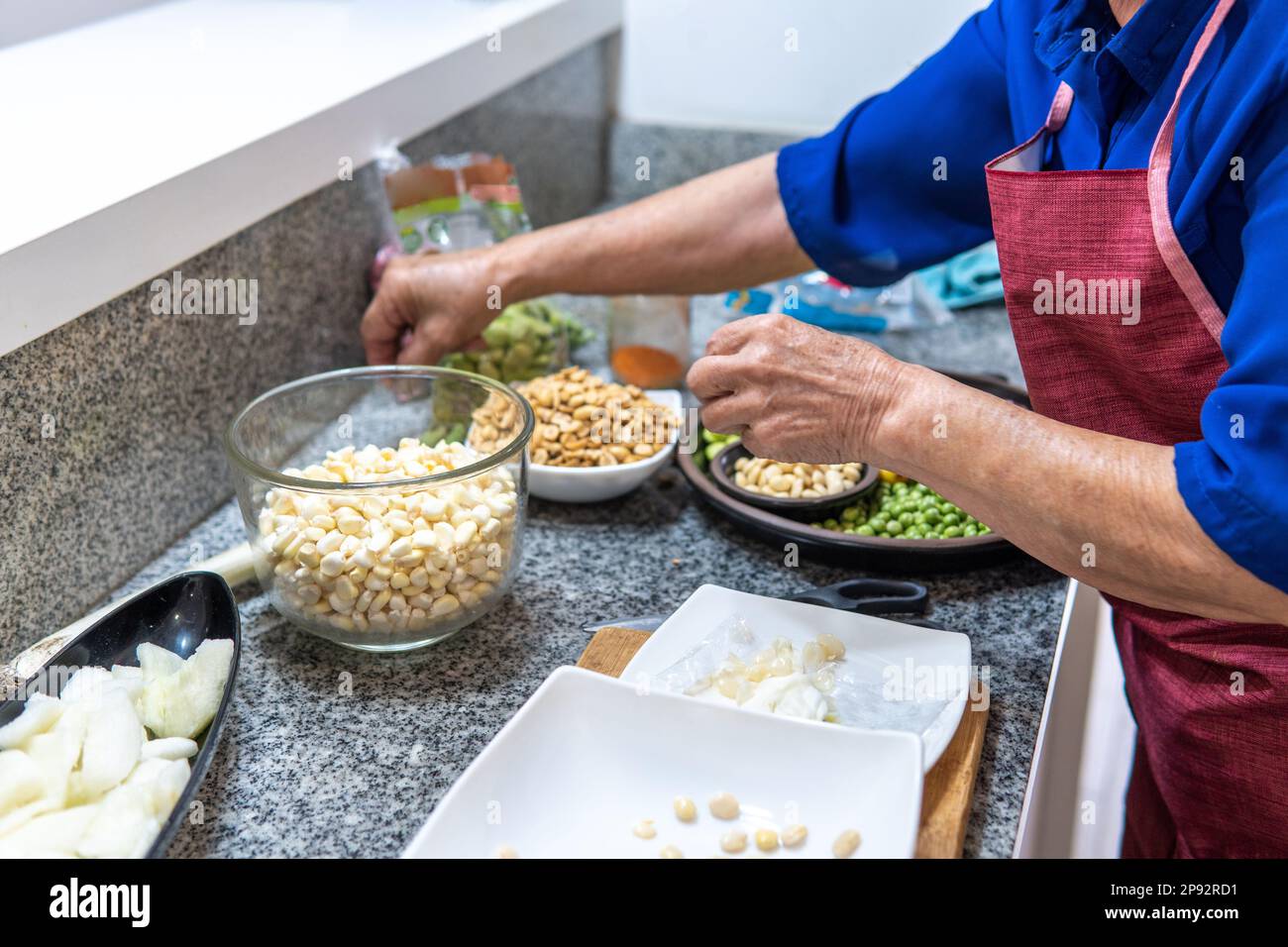 Unrecognizable woman preparing legumes to cook fanesca Stock Photo - Alamy