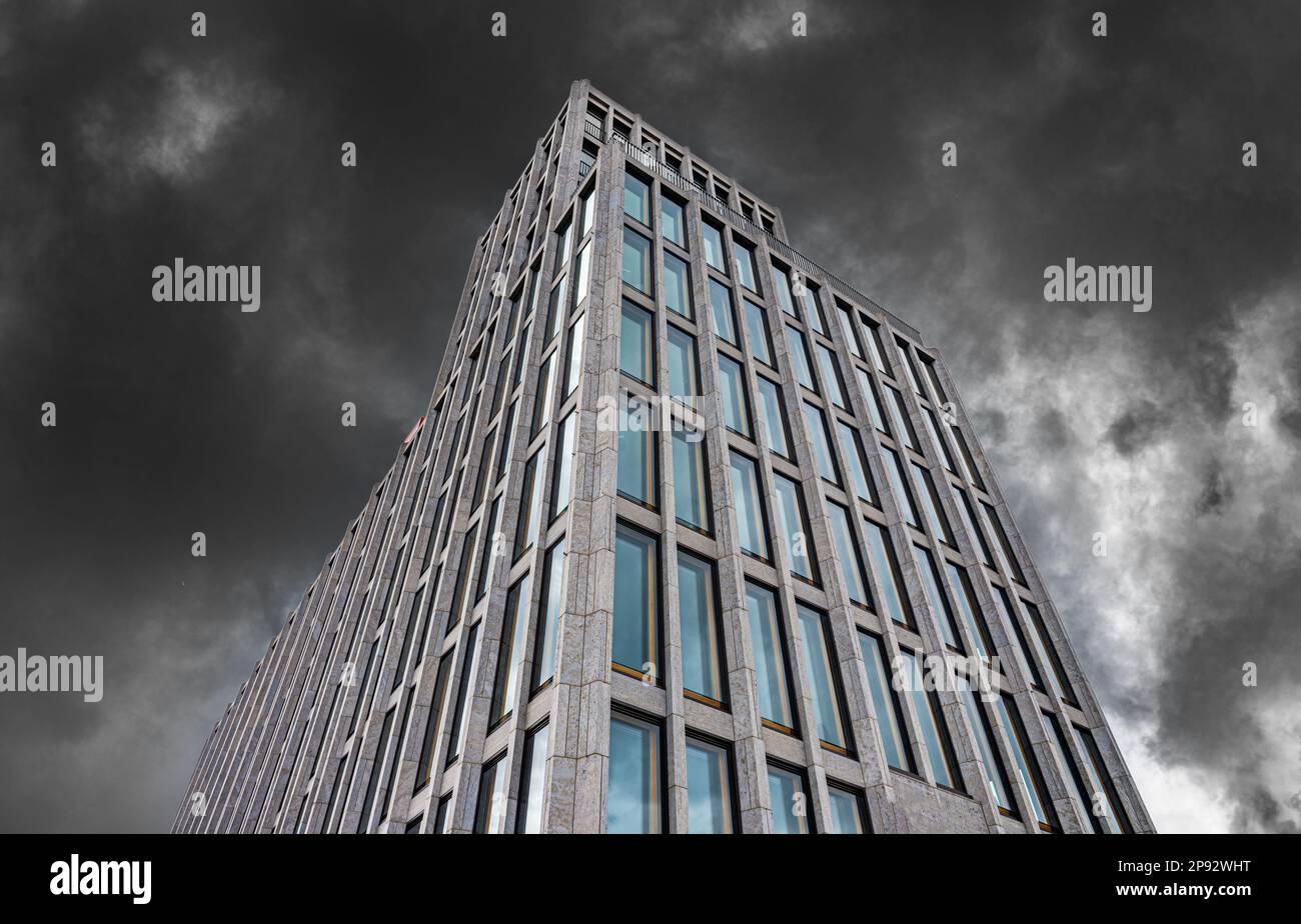 Building under the dark storm clouds Stock Photo - Alamy