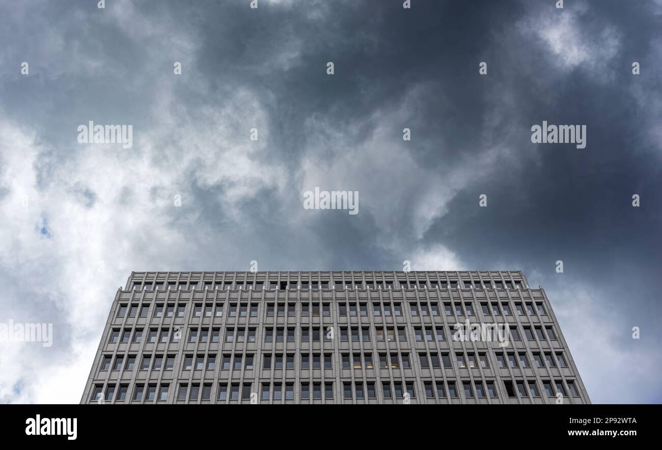 Building under the dark storm clouds Stock Photo - Alamy