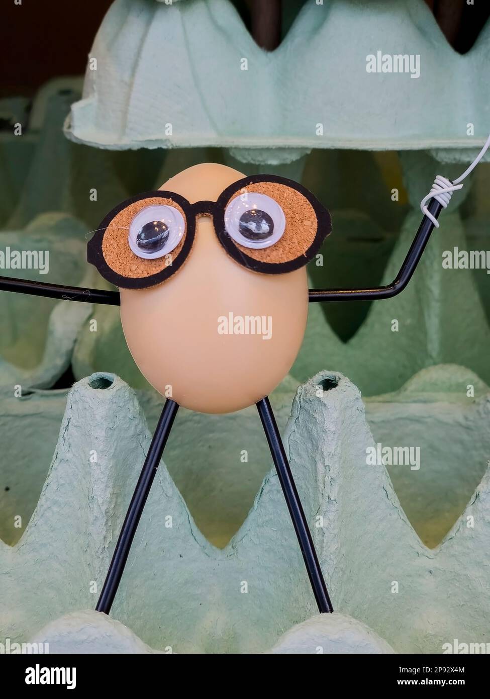 A humanized egg with eyes and glasses. Egg character Stock Photo - Alamy