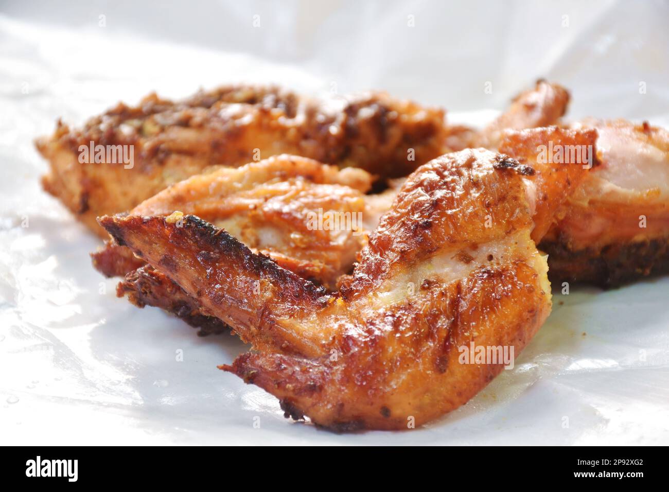 grilled chop chicken wing on white paper packaging take out food Stock ...