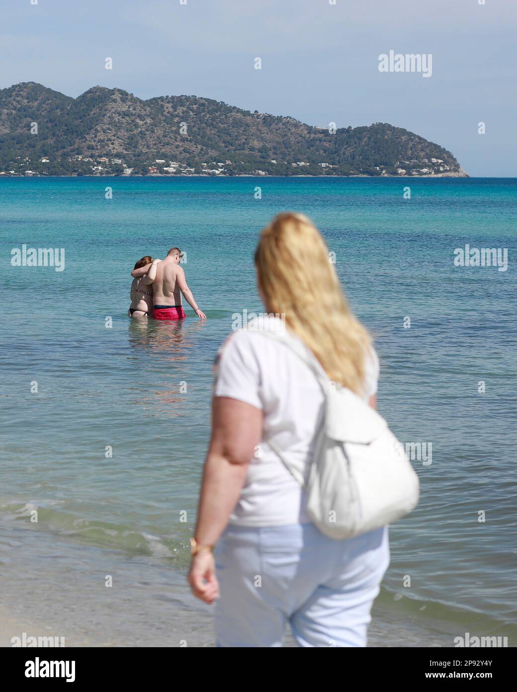 Son Servera, Spain. 10th Mar, 2023. A woman walks on the beach of Cala ...