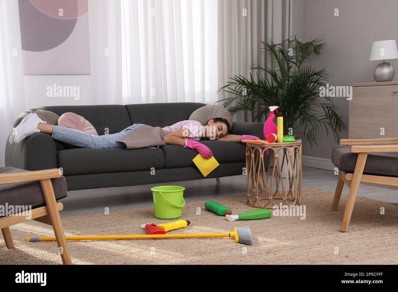 Woman house mess sofa hi-res stock photography and images - Alamy