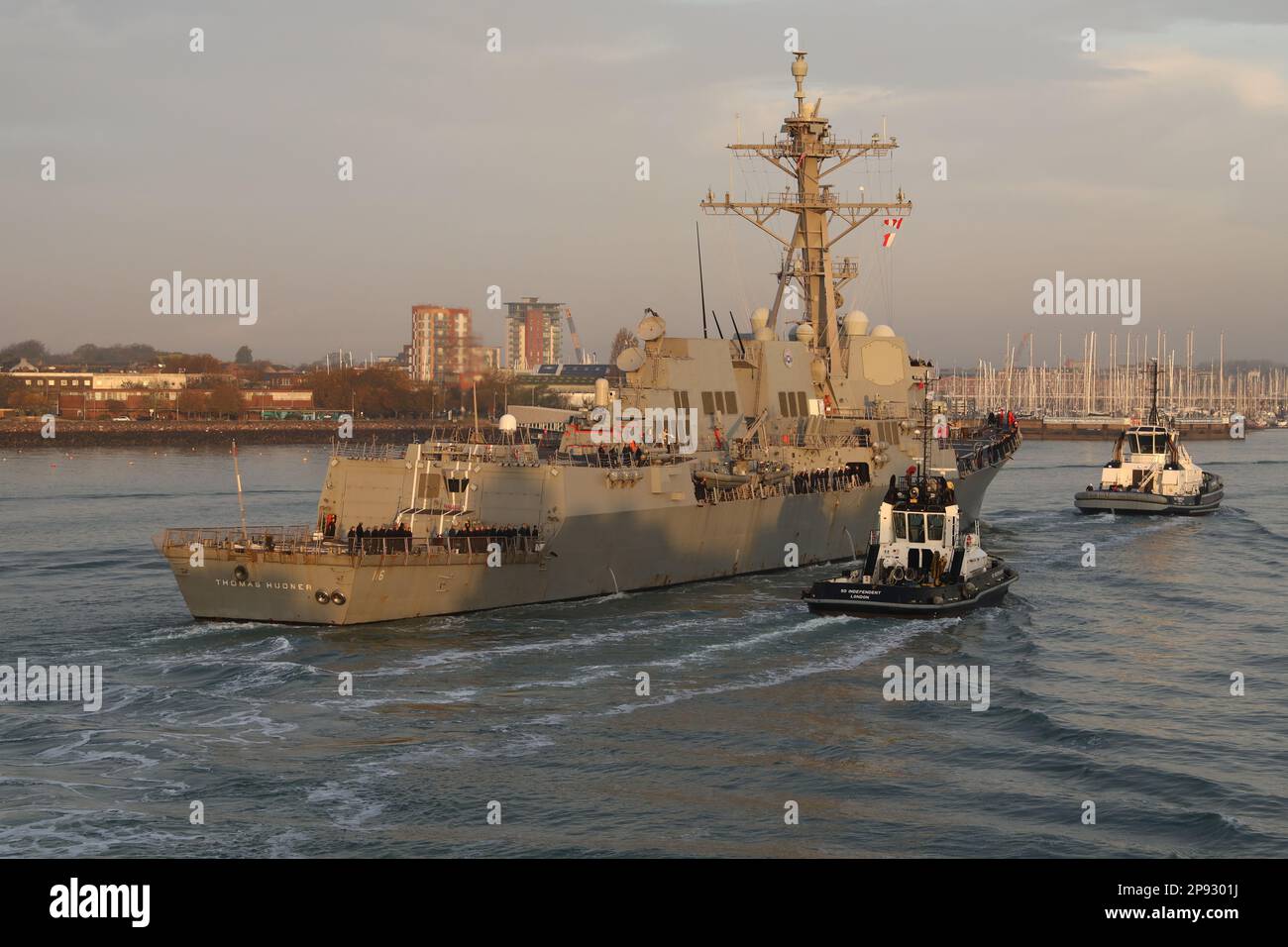 Naval Base tugs guide the United States navy destroyer USS THOMAS ...