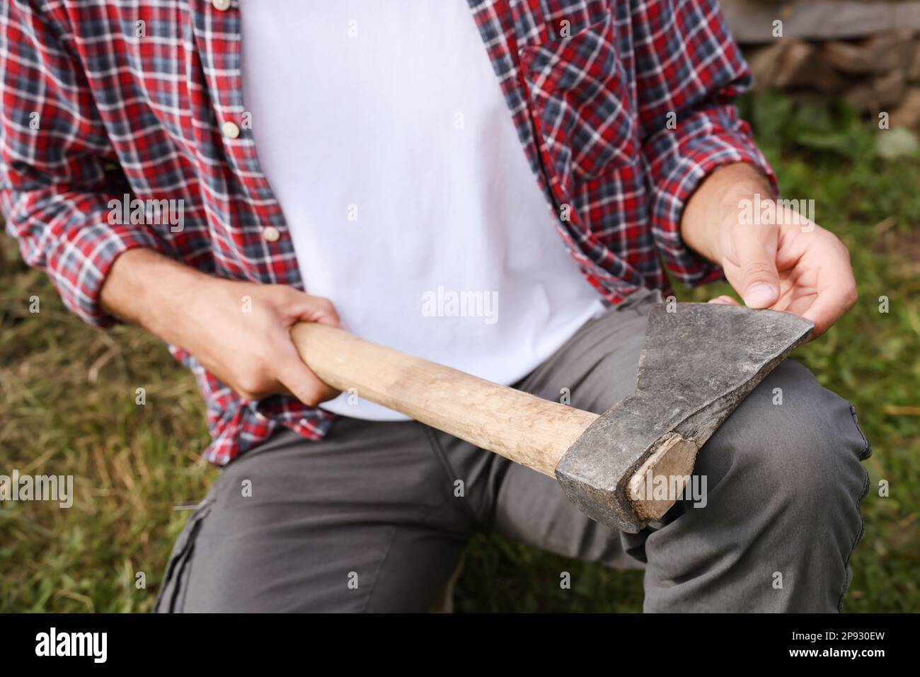 Hand holding ax hi-res stock photography and images - Alamy