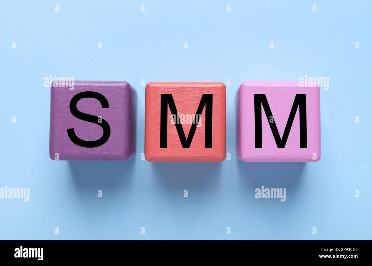 Colorful cubes with abbreviation SMM (Social media marketing) on light ...
