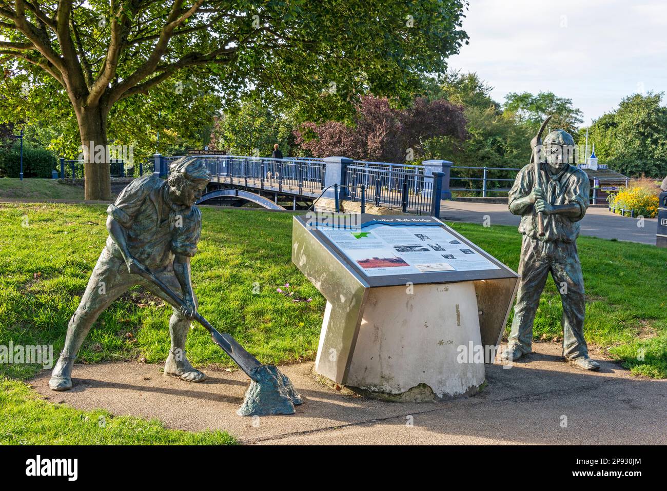 A bronze monument of two canal diggers next to the Ladies Walk bridge ...