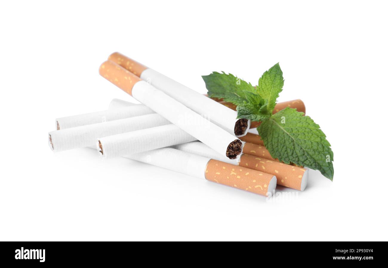 Menthol cigarettes and fresh mint leaves on white background Stock ...