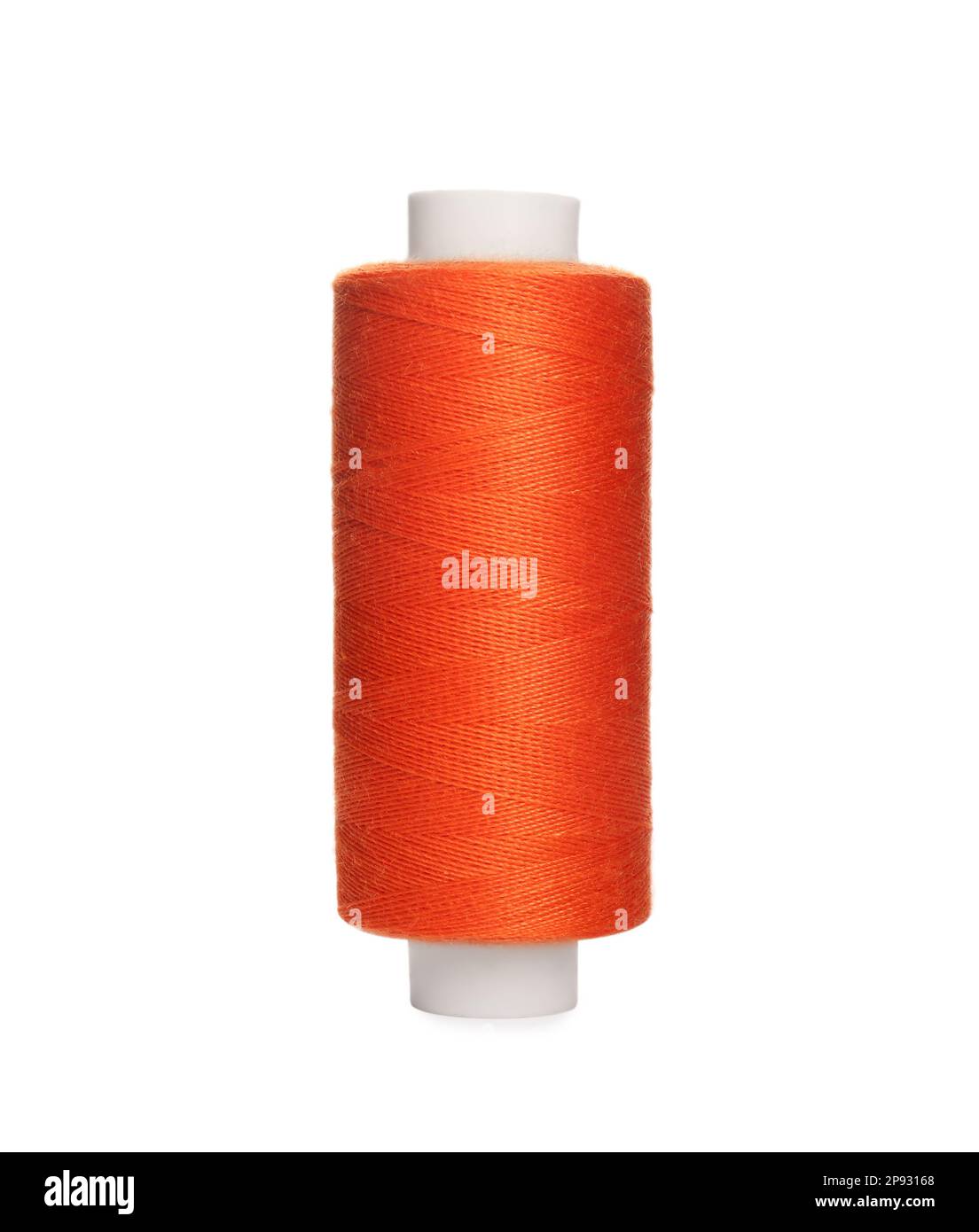 Spool of orange sewing thread isolated on white Stock Photo - Alamy