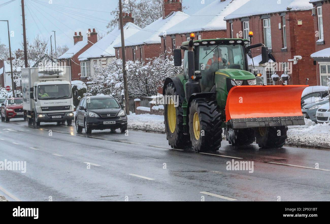 Barnsley, UK. 10th Mar, 2023. A tractor snowplow is out on the roads as ...