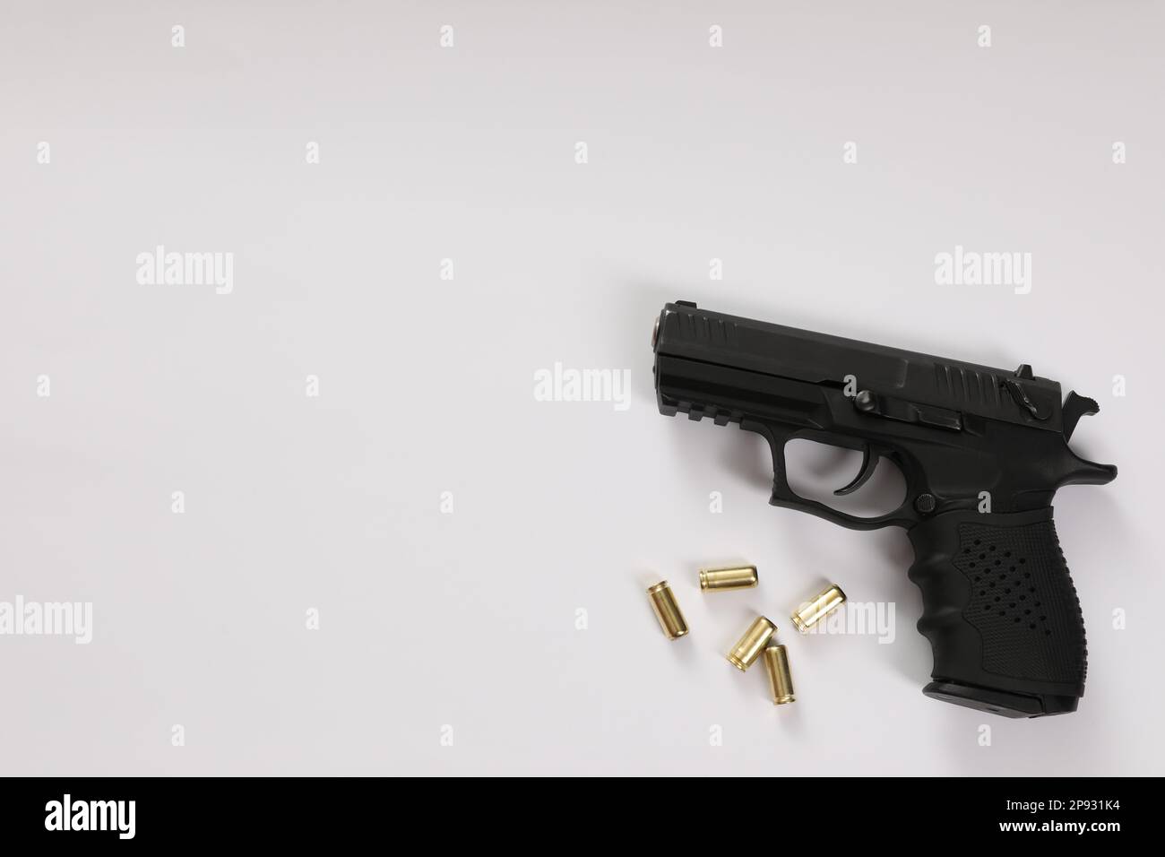 Handgun and bullets on white background, flat lay. Space for text Stock ...