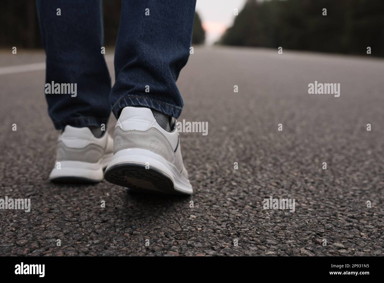 Male legs walking along road hi-res stock photography and images - Alamy