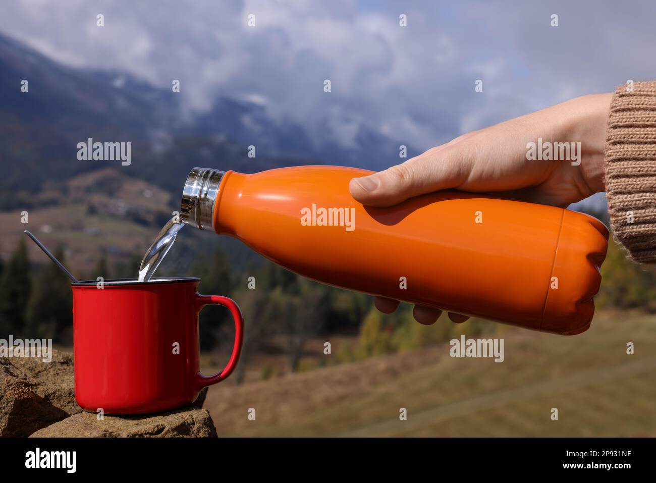 Female hand pouring water aroma hi-res stock photography and images - Alamy