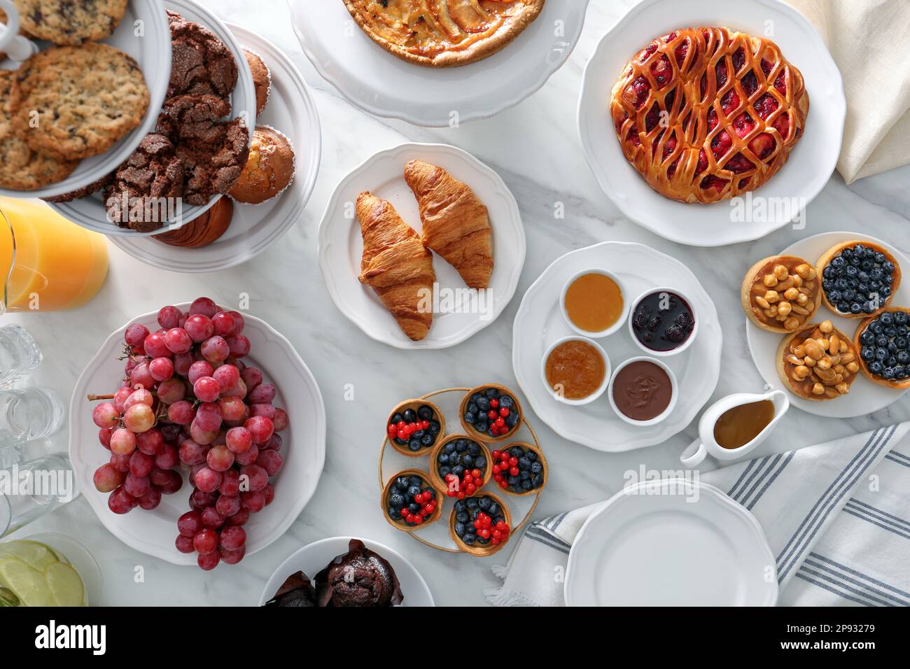 Variety of snacks on white marble table in buffet style, flat lay Stock ...