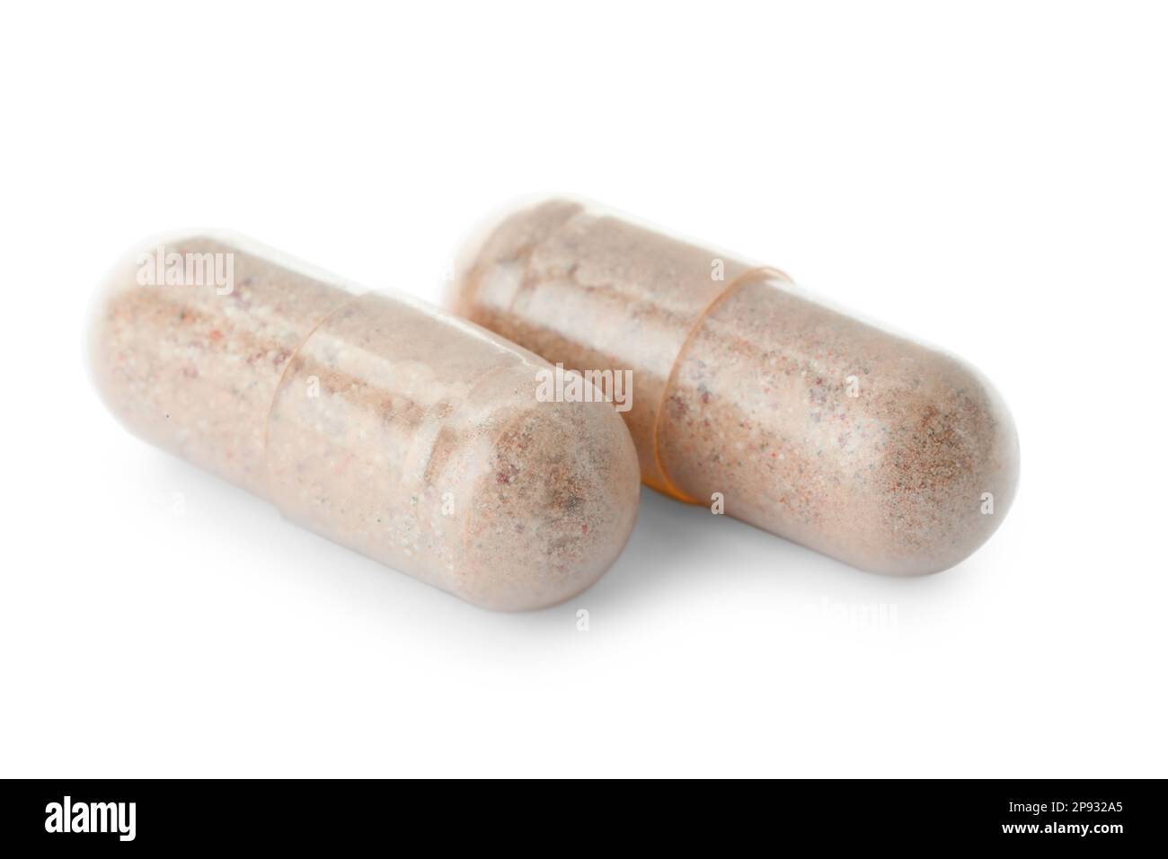 Two transparent gelatin capsules on white background, closeup Stock ...