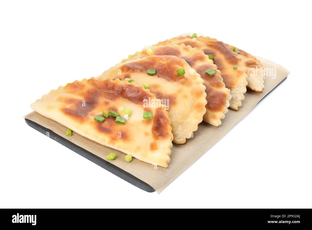 Board with delicious fried chebureki isolated on white Stock Photo - Alamy