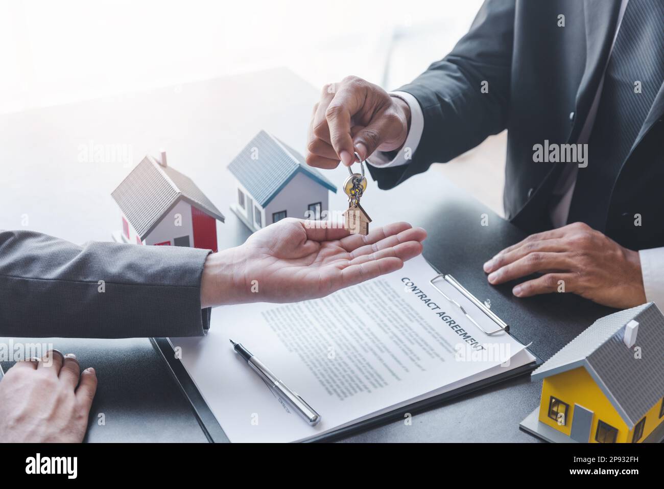 Home sales,home rental and real estate concept.Hands of estate agent ...