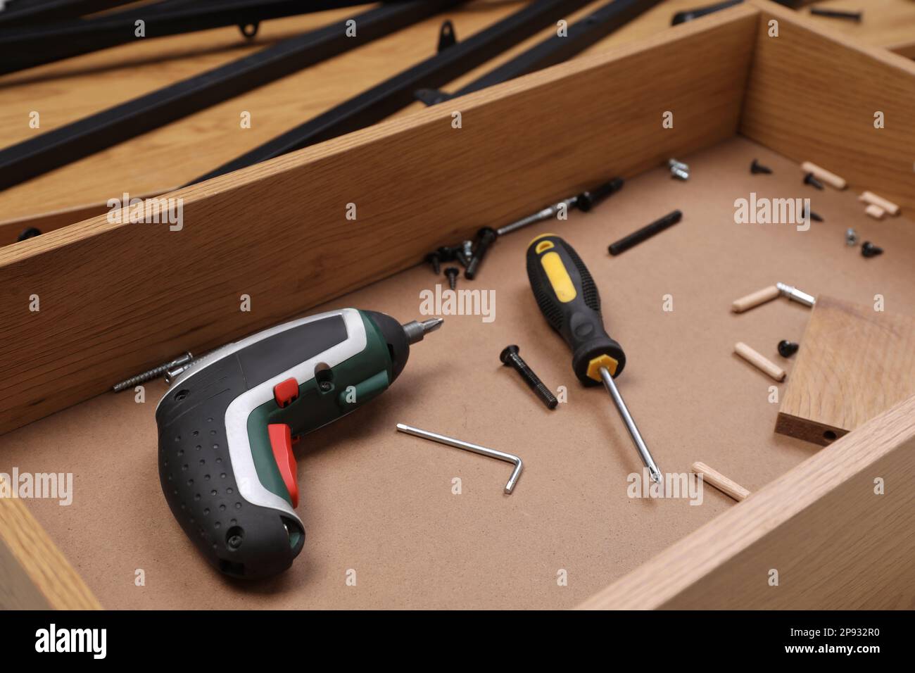 Equipment for furniture assembly inside of wooden drawer Stock Photo ...