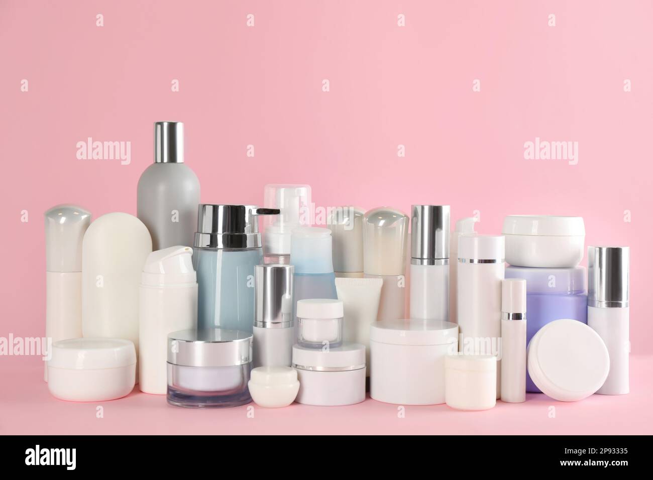 Many different cosmetic products on pink background Stock Photo - Alamy