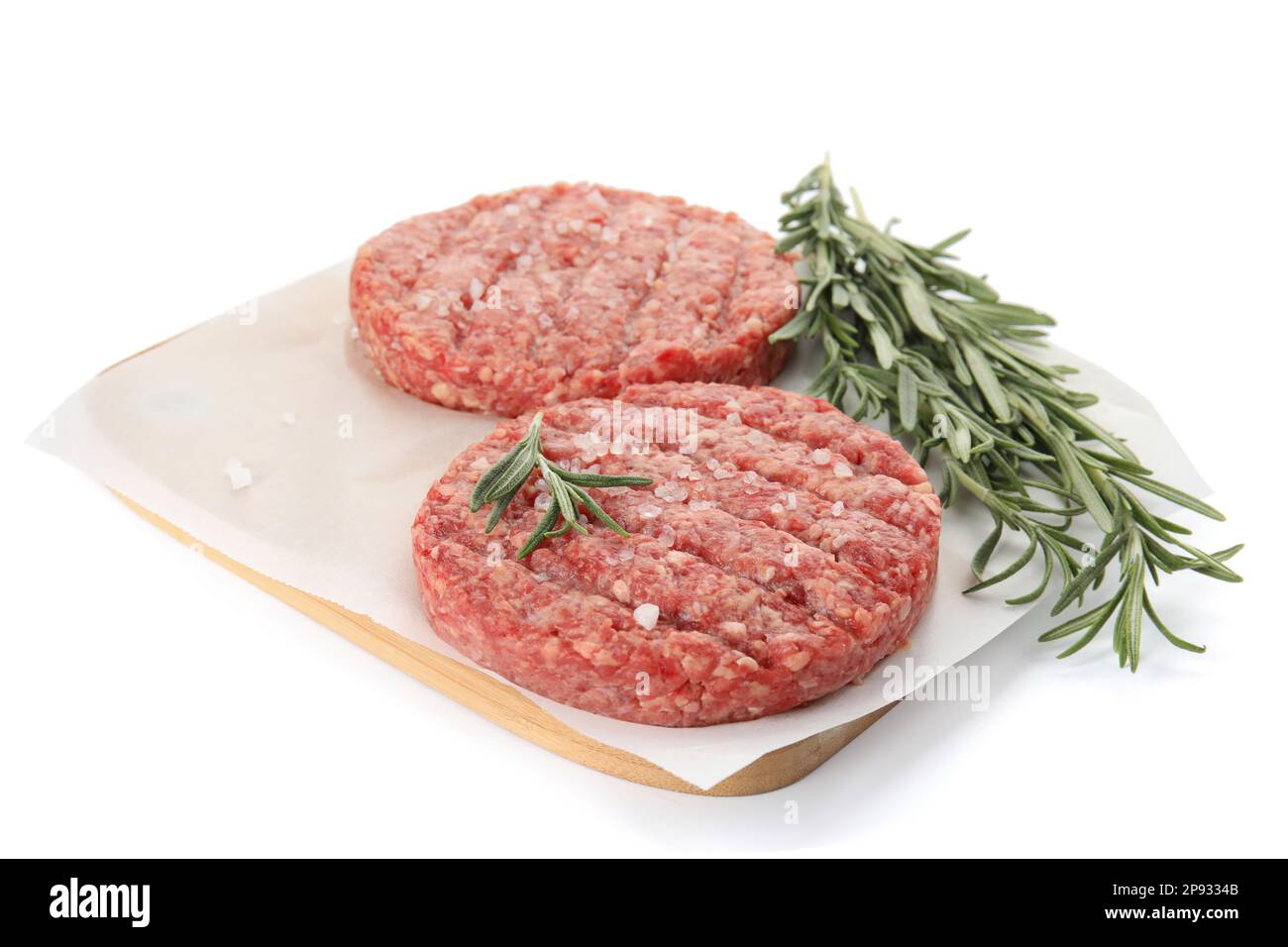 Raw hamburger patties with rosemary and salt on white background Stock ...