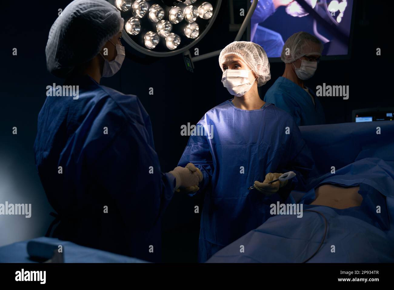 Surgical gloves handshake hi-res stock photography and images - Alamy
