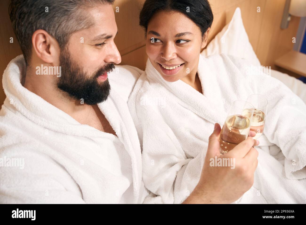 Romantic mixed-race couple celebrating their anniversary in luxury ...