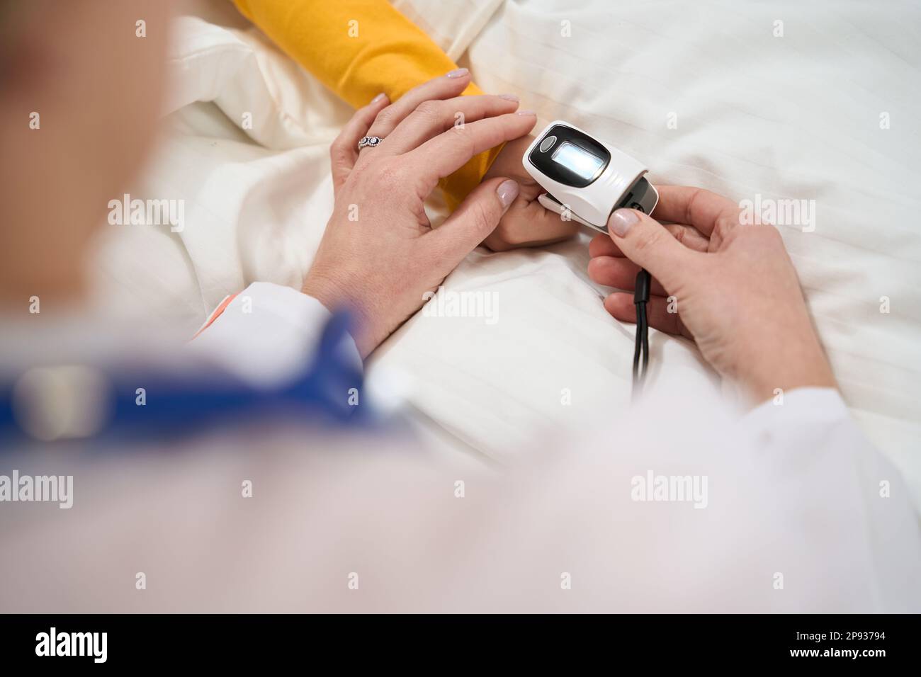 Qualified pediatrician is doing checkup of child health in the medicine ...