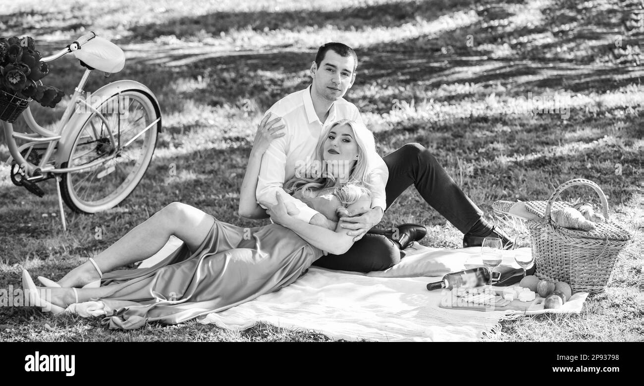 Romantic picnic. Man and woman in love. Couple sit blanket. Happy together. Picnic time. Arrived ...