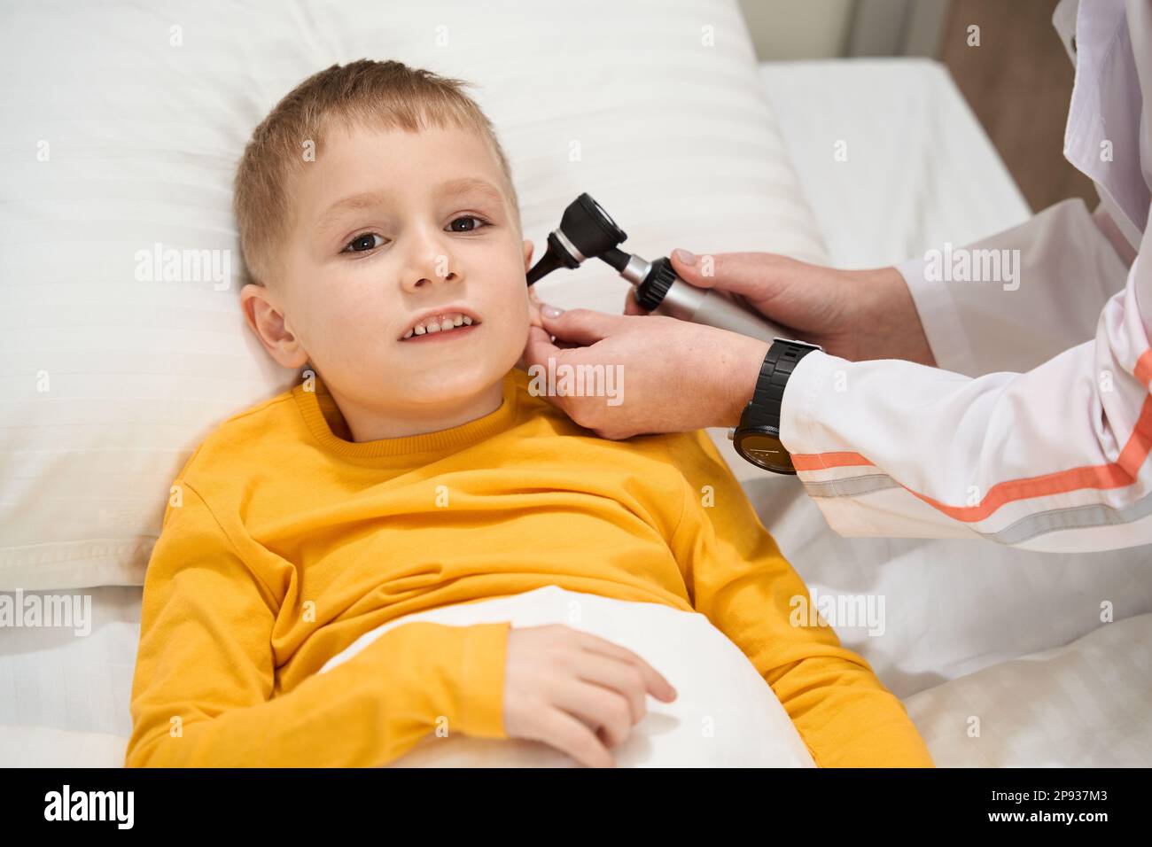 Good looking child is getting examining health in modern clinic Stock ...
