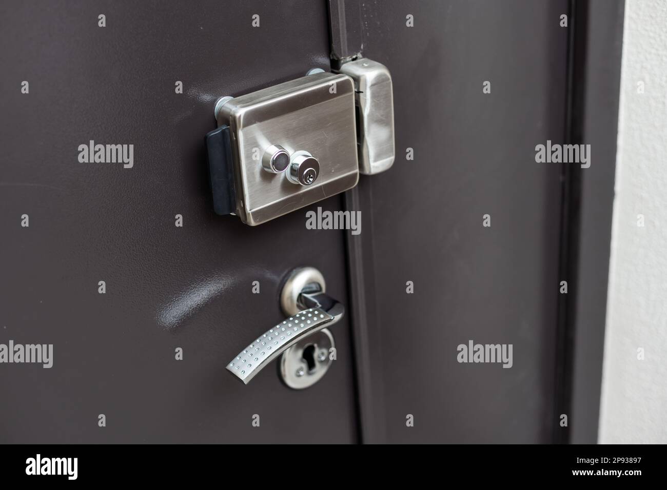 Exterior door handle and Security lock on Metal frame Stock Photo - Alamy
