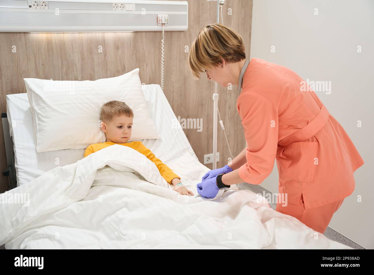 Child with catheter in hand receiving qualified service in the medicine ...