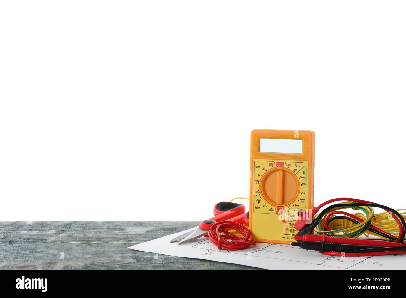 Set of electrician's tools and accessories on wooden table against ...
