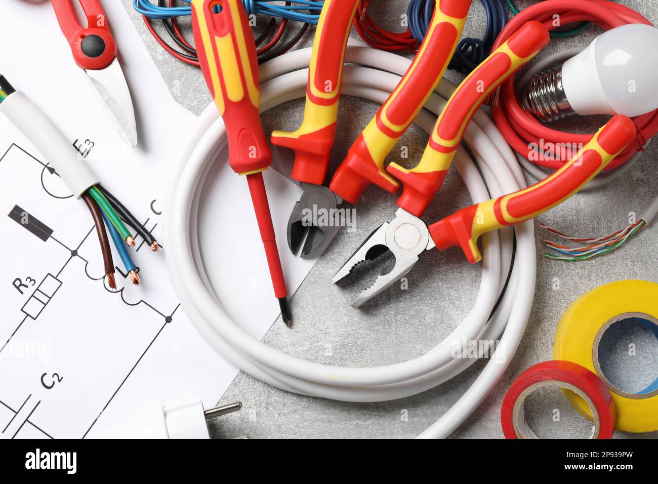 Set of electrician's tools and accessories on grey background Stock ...
