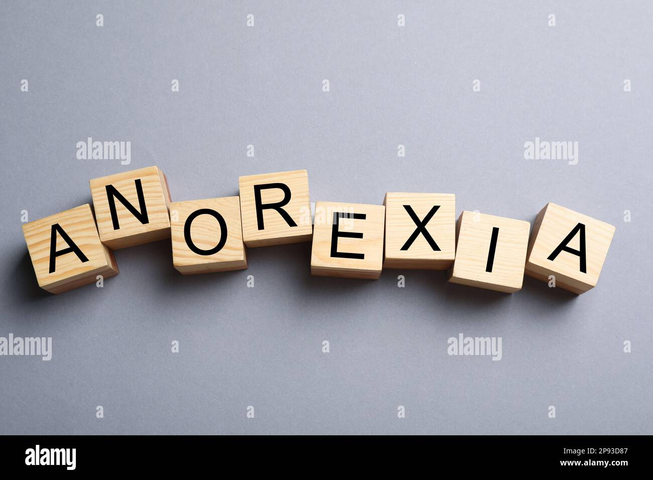 Word Anorexia made of wooden cubes with letters on light grey ...