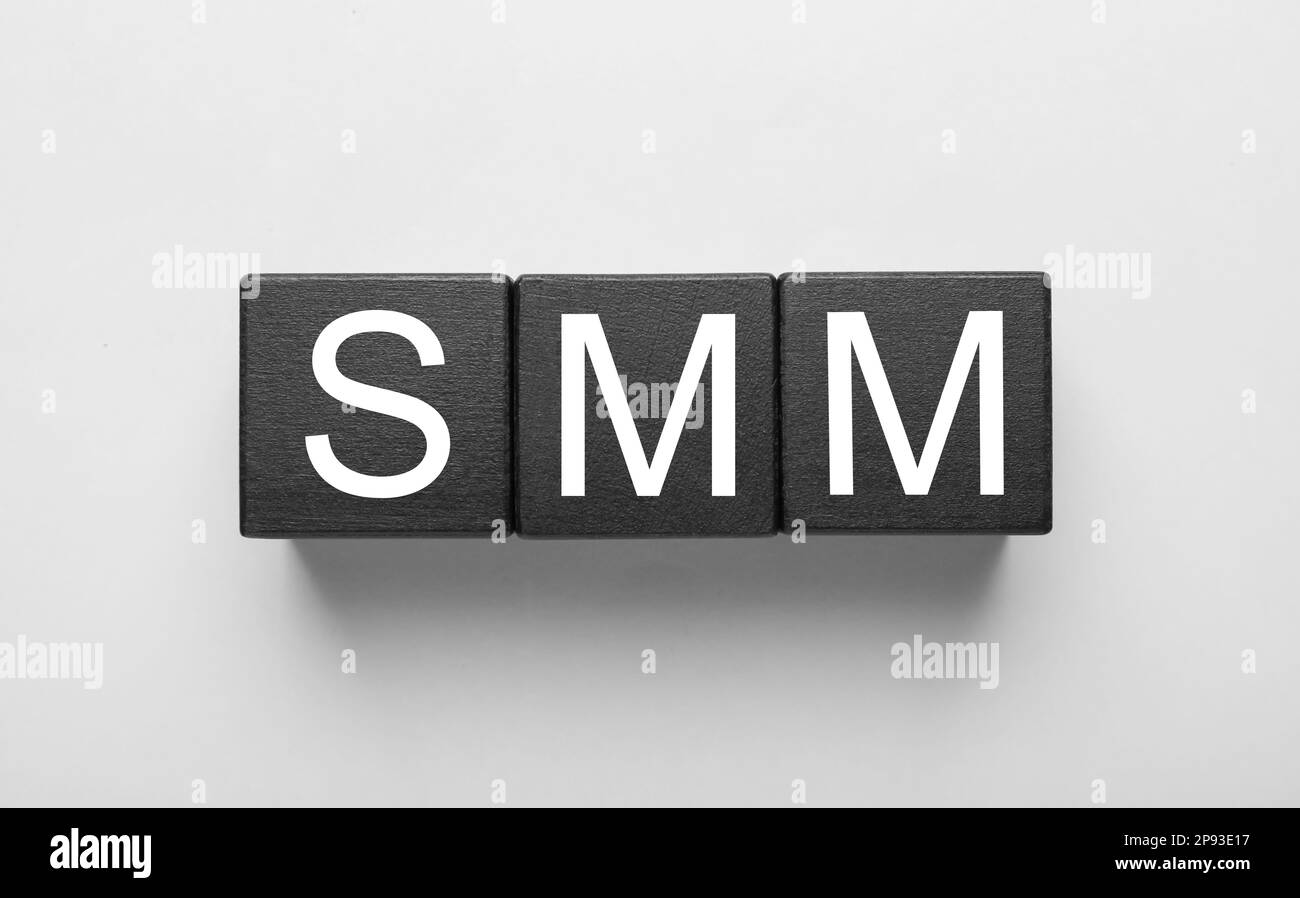 Cubes with abbreviation SMM (Social media marketing) on white ...