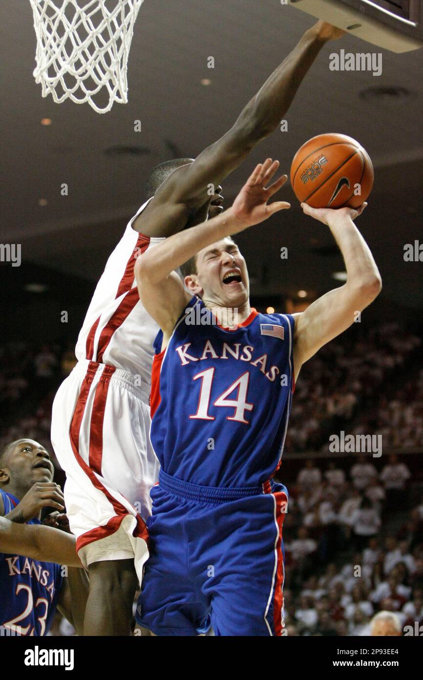 Kansas guard Tyrel Reed (14) has his shot blocked by Oklahoma's Juan ...