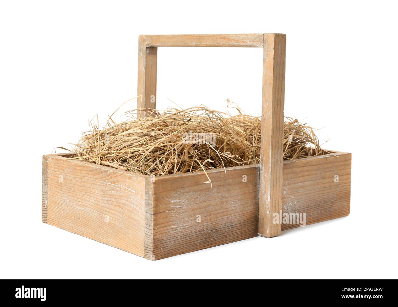 Dried hay in wooden basket on white background Stock Photo - Alamy
