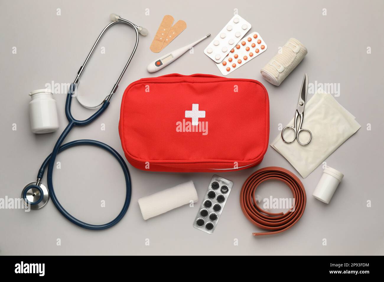Flat lay composition with first aid kit on light grey background Stock ...