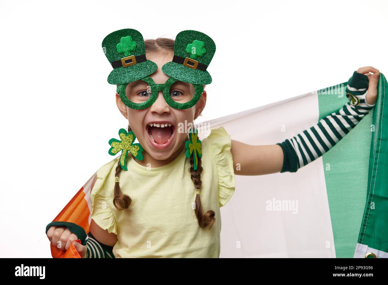 Irish little girl wearing stylish carnival eyewear, dressed as ...