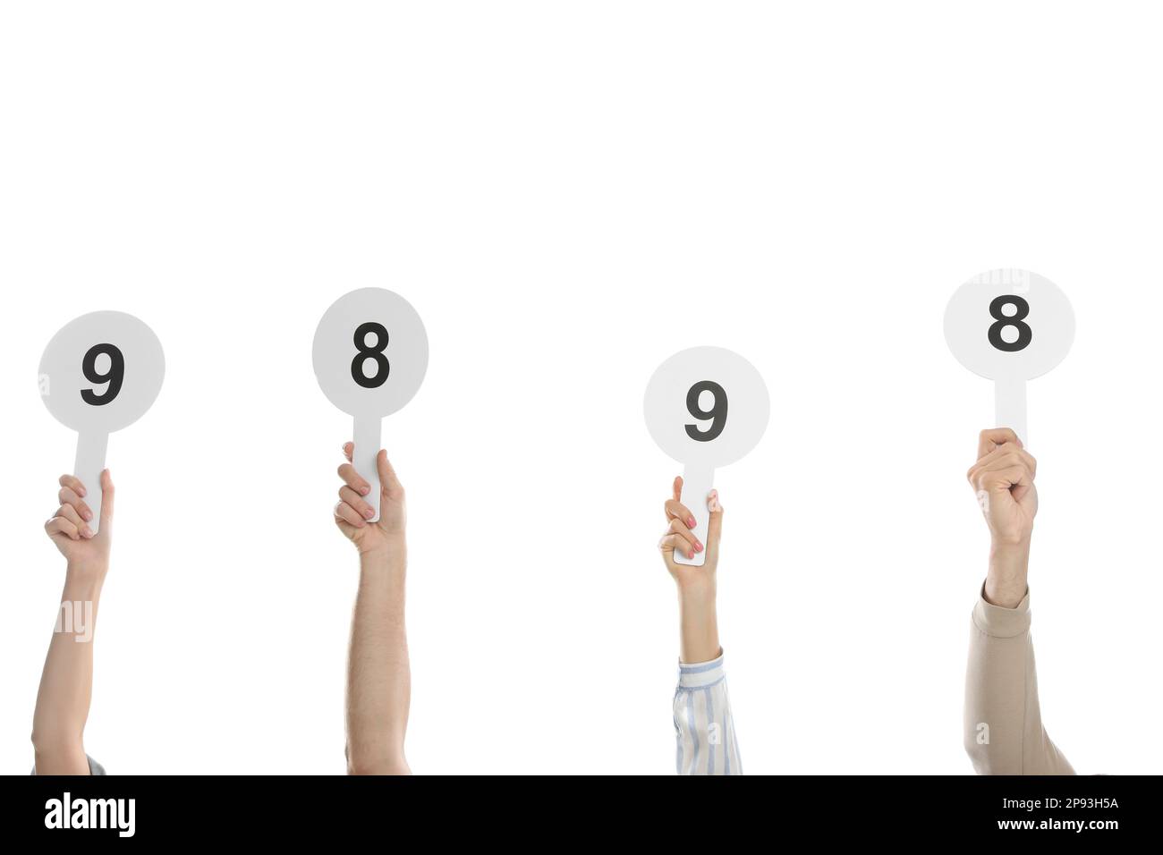 Panel of judges holding different score signs on white background ...
