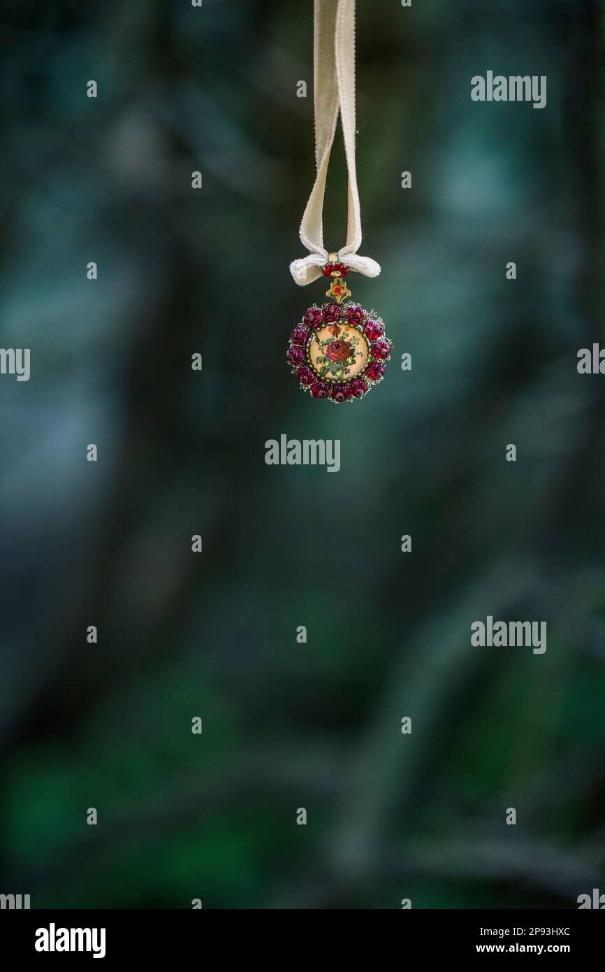 Antique chain with a rose amulet Stock Photo - Alamy