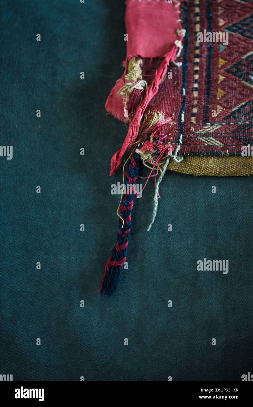 Broken corner of oriental carpet Stock Photo - Alamy