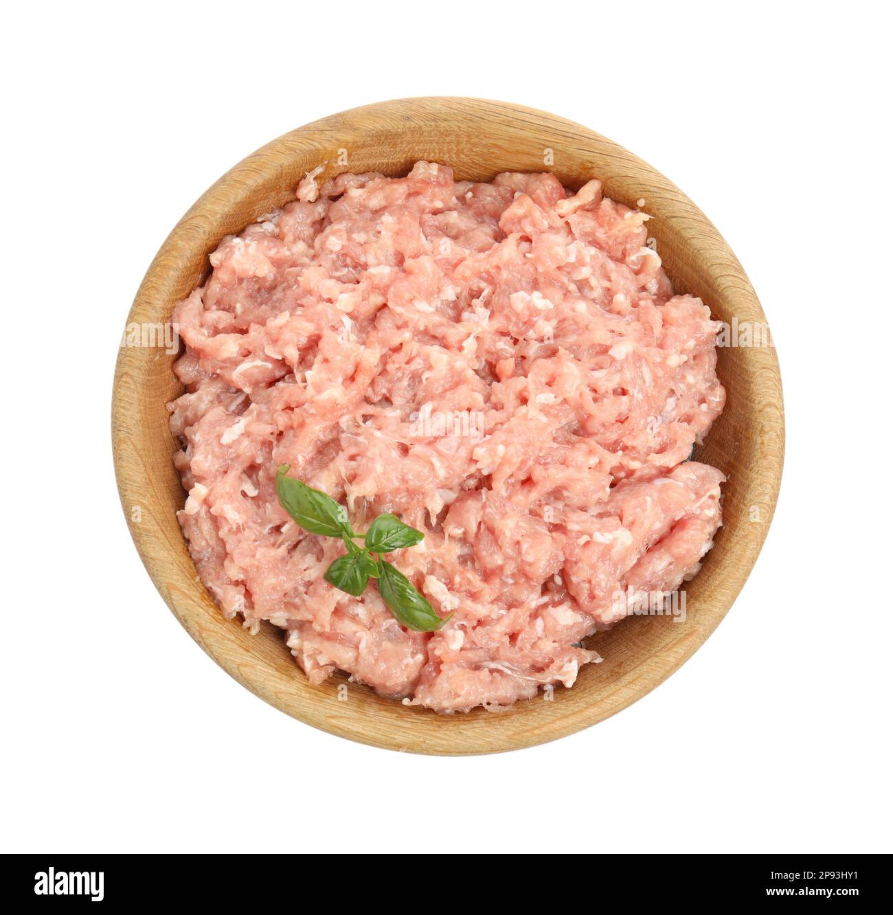 Raw chicken minced meat with basil in bowl on white background, top ...
