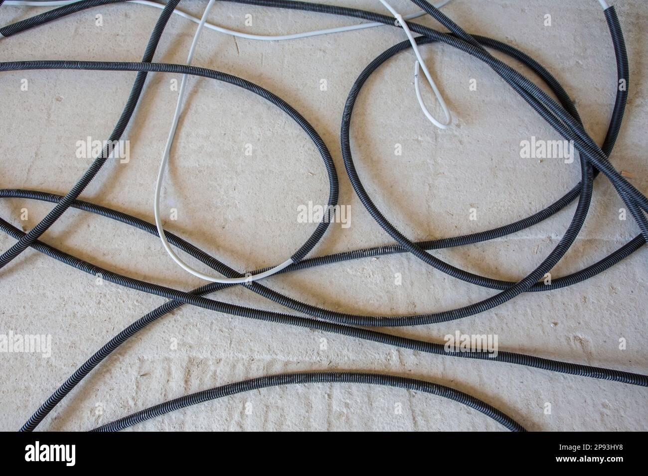 Messy pile of cables on the screed Stock Photo - Alamy