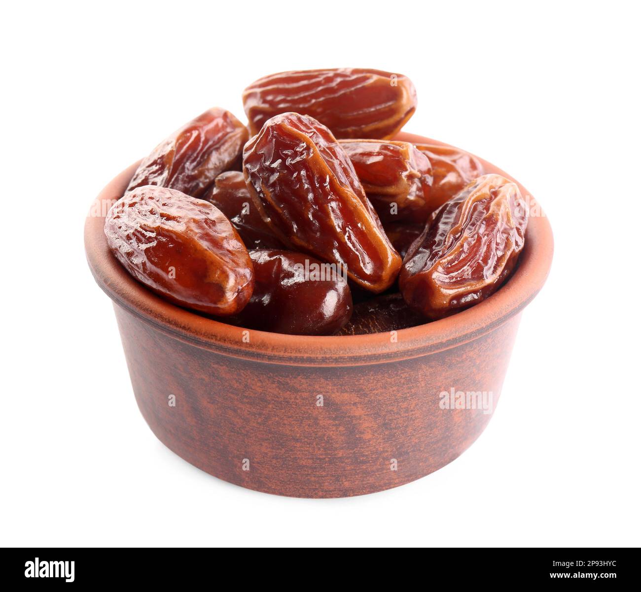 Sweet dried dates in bowl on white background Stock Photo - Alamy