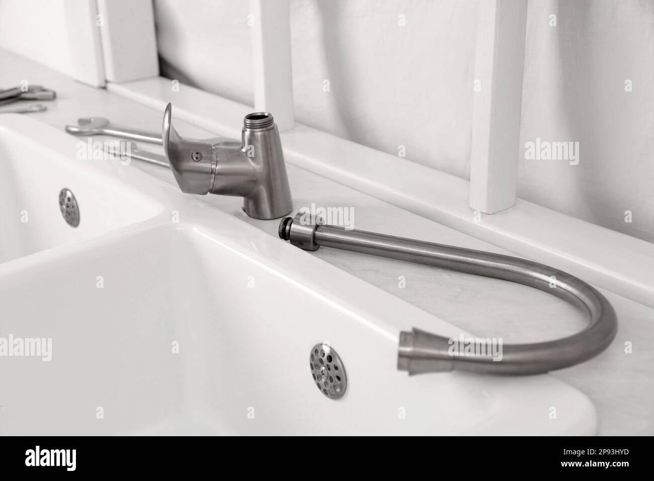 Plumber's tools and water tap ready for installation near sink on ...