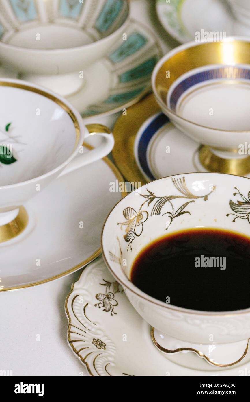 Gold decorated collectible cups Stock Photo - Alamy