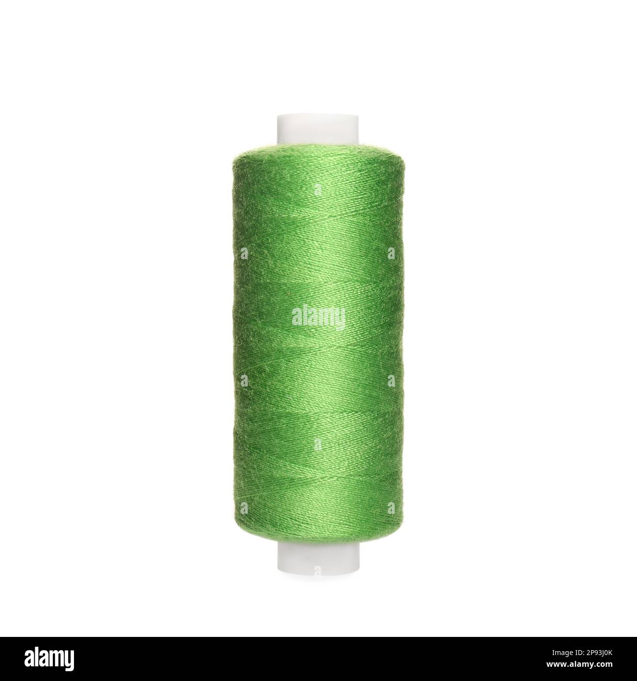 Spool of light green sewing thread isolated on white Stock Photo - Alamy