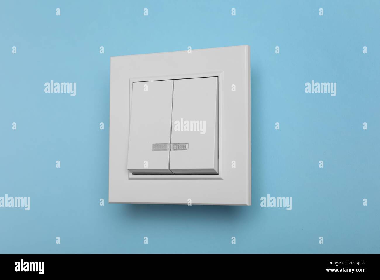 White plastic light switch on turquoise background Stock Photo - Alamy
